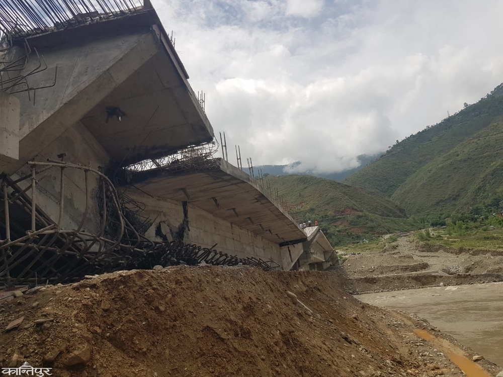 A motorable bridge under construction across the Tamakoshi River broke ...